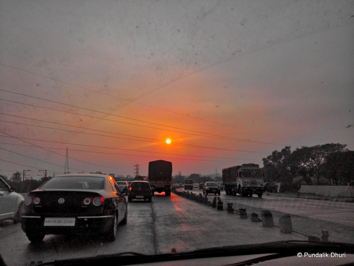 Sunrise from a Dirty Windshield | उनाड